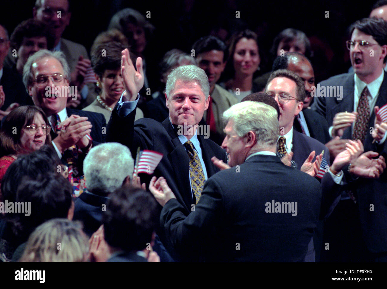 US President Bill Clinton surrounded by Congressional supporters waves ...