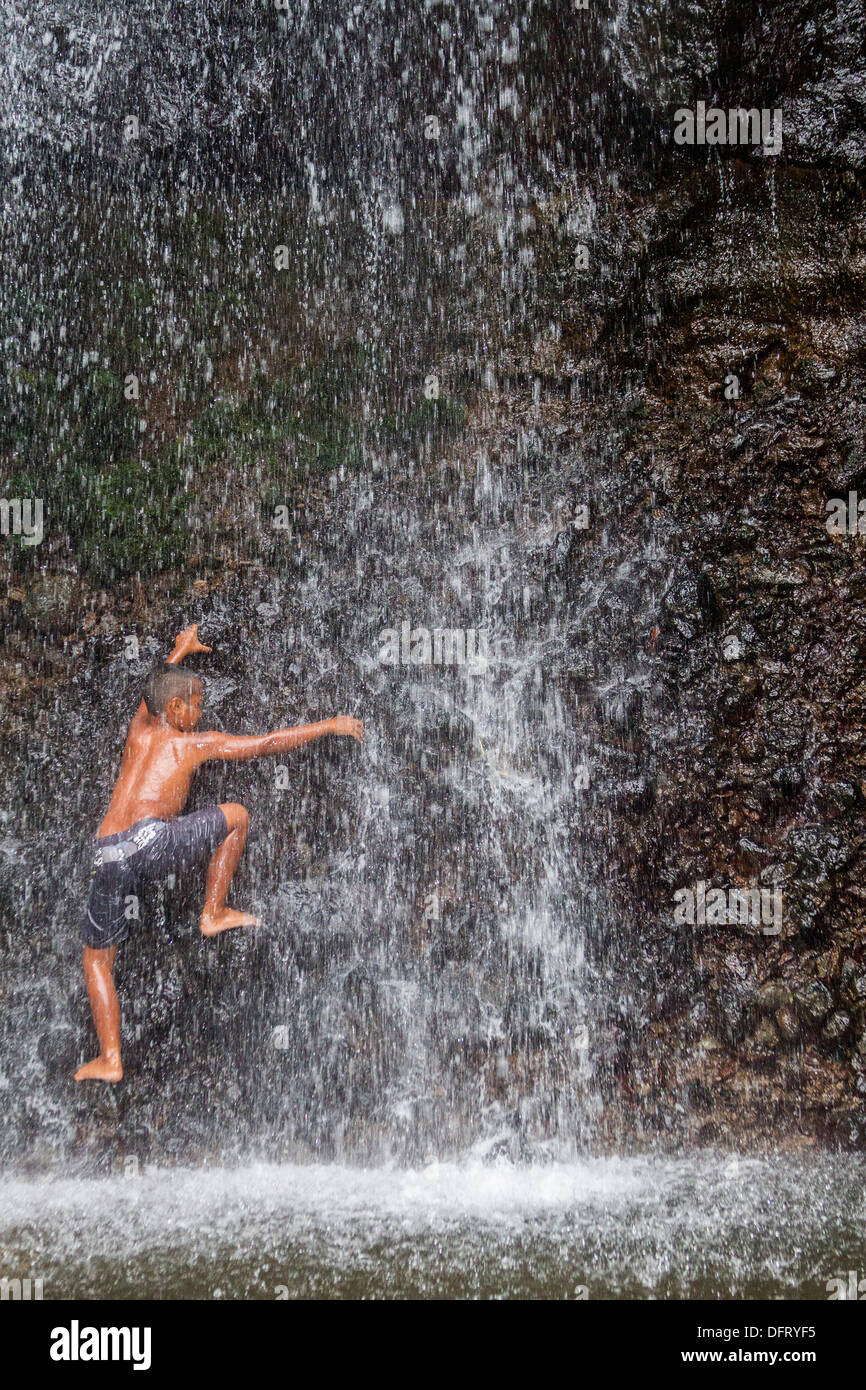 Boy in waterfall hi-res stock photography and images - Alamy