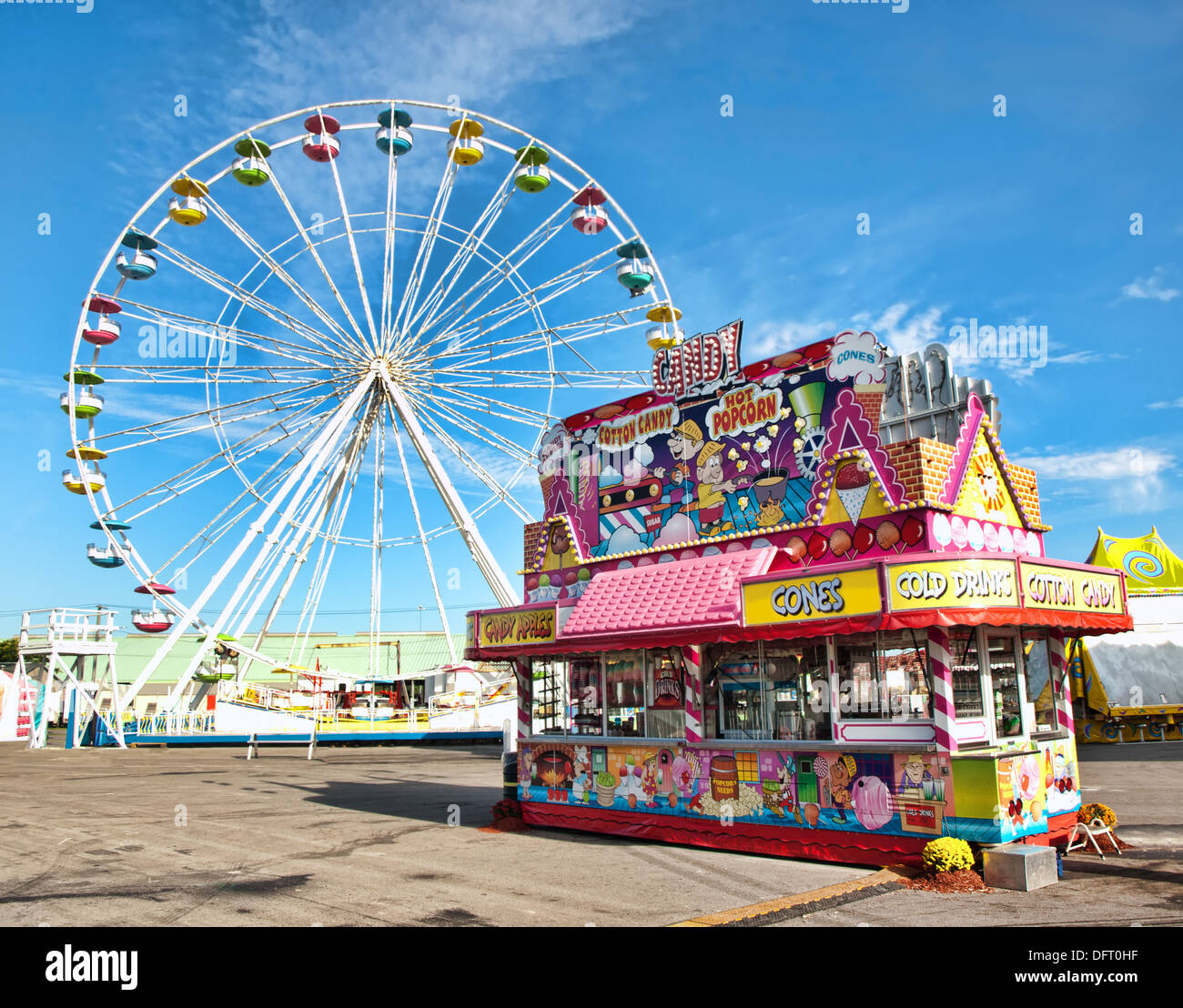 ferris wheel and candy stand on a midway at a fair Stock Photo - Alamy