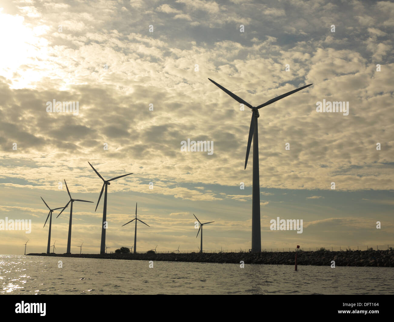 Environment and renewable energy. Landscape with wind turbines, sea and ...