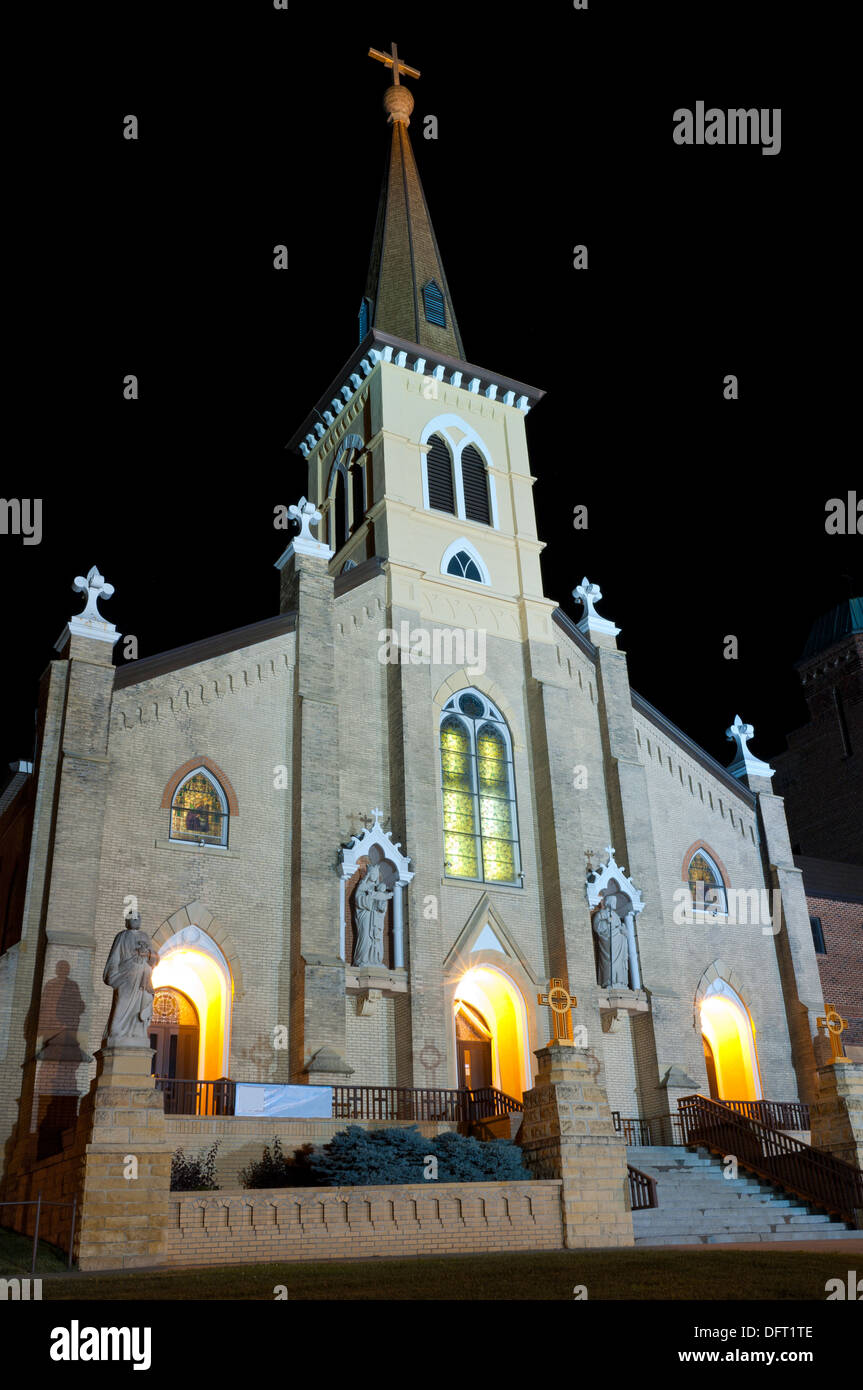 Roman Catholic church front illuminated at night in downtown Mankato ...