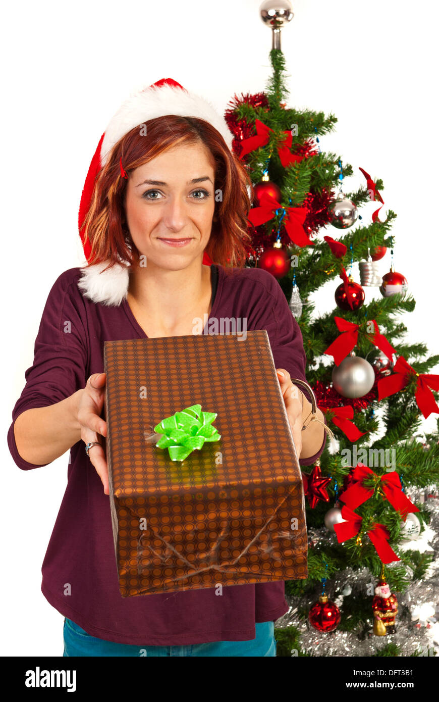 Christmas woman giving a gift to you against white Stock Photo - Alamy