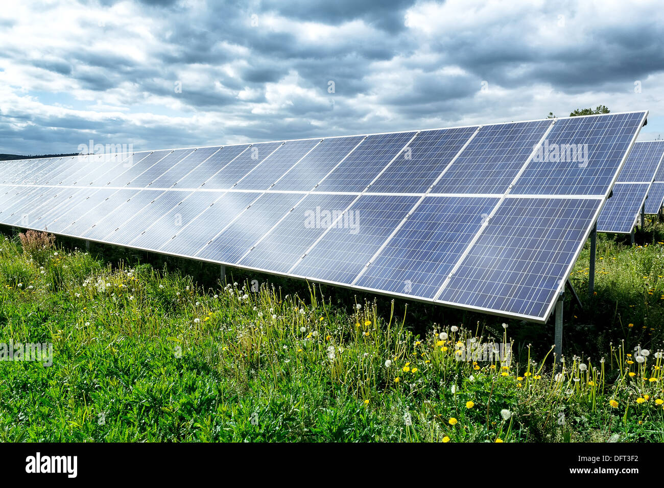 Solar energy panels against dramatic storm sky Stock Photo - Alamy