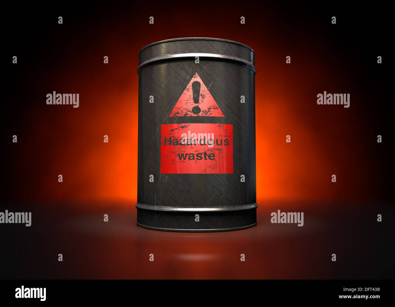 A black metal barrel with a red hazardous waste label on an a dark ...