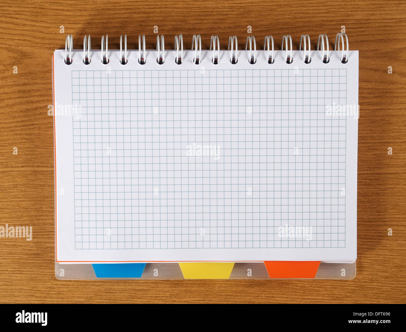 Open spiral notebook lying on desk Stock Photo - Alamy