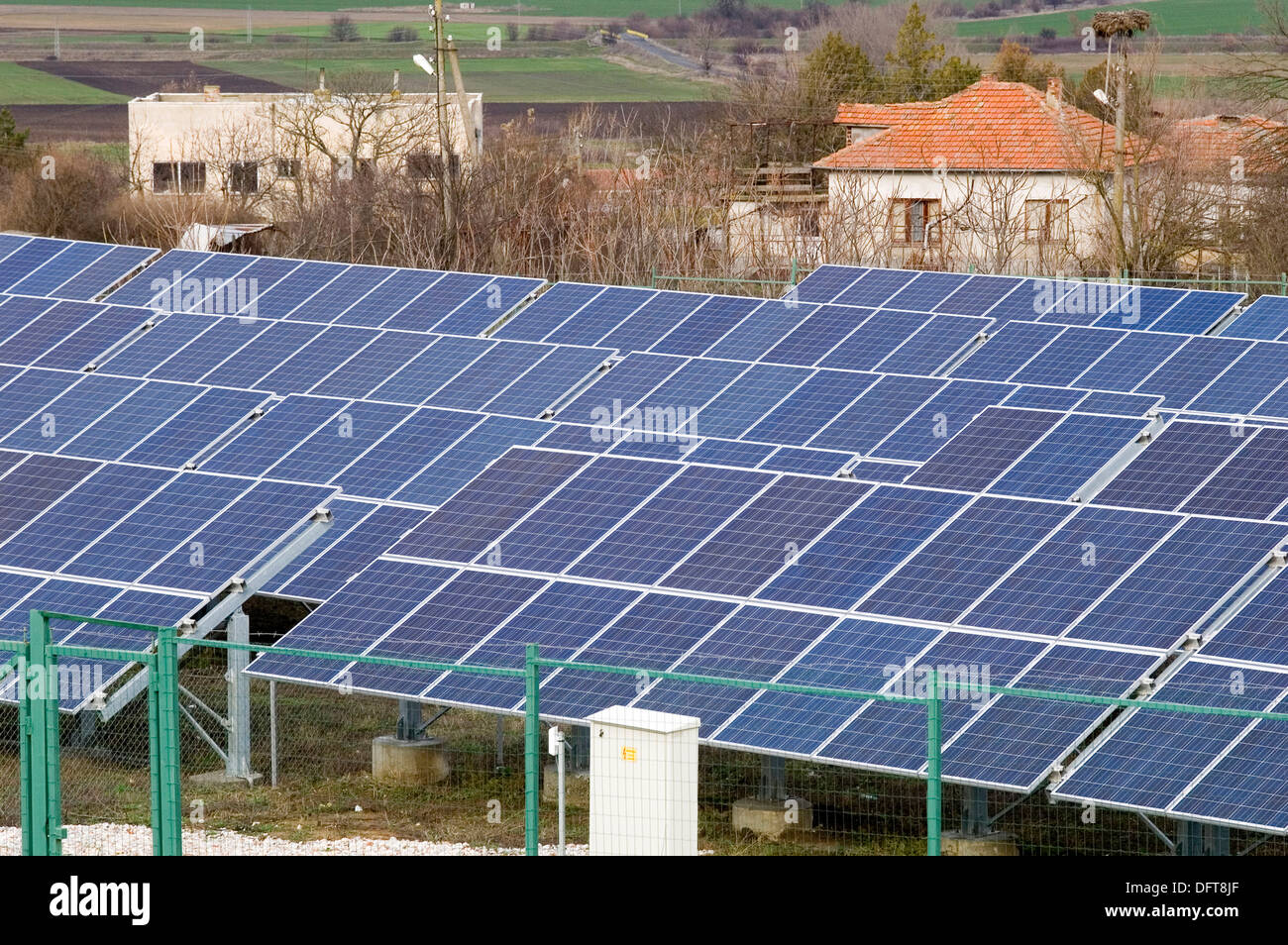 Solar power farm in a rural village Stock Photo - Alamy