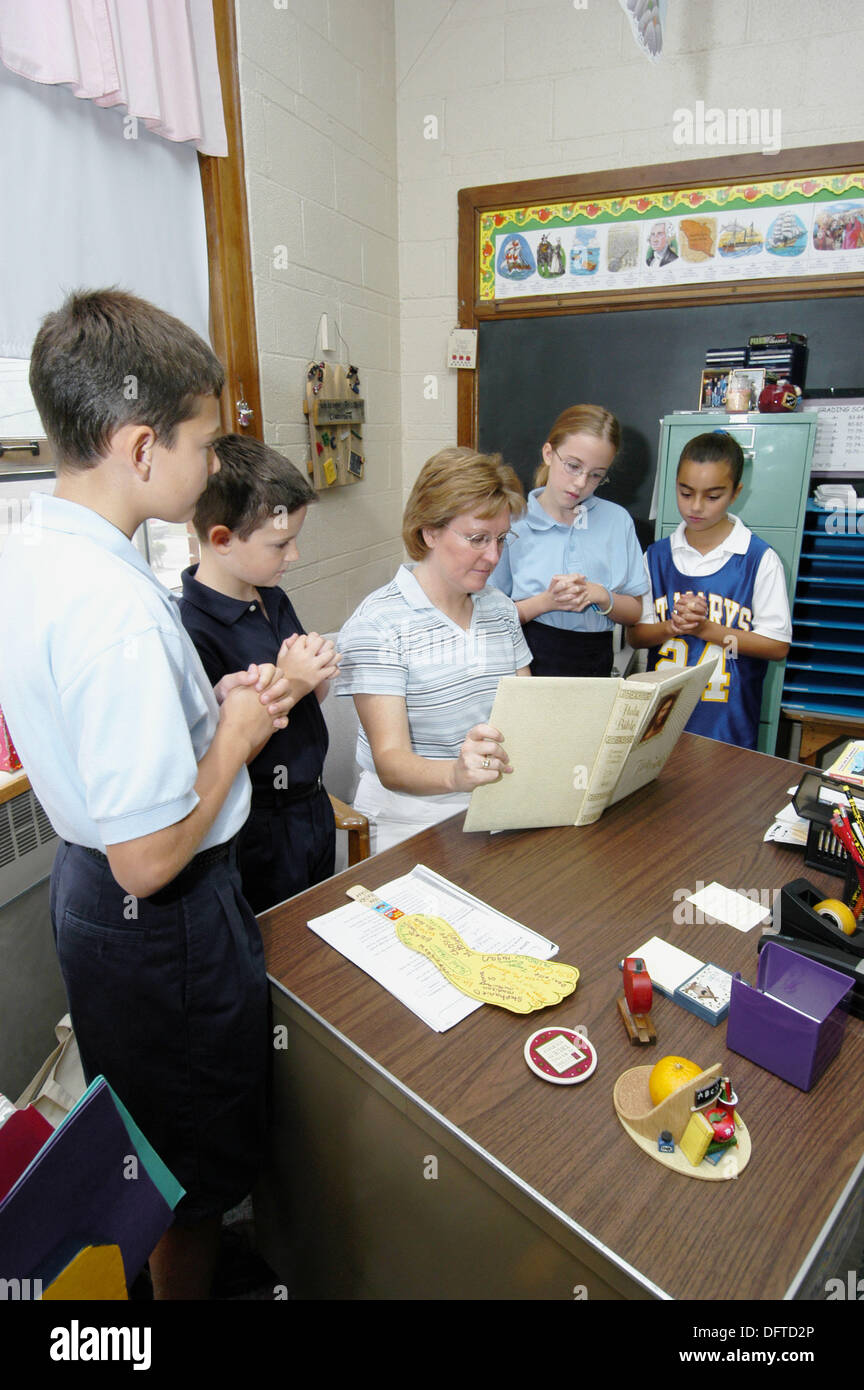Teacher in religious class training in a Catholic elementary school ...