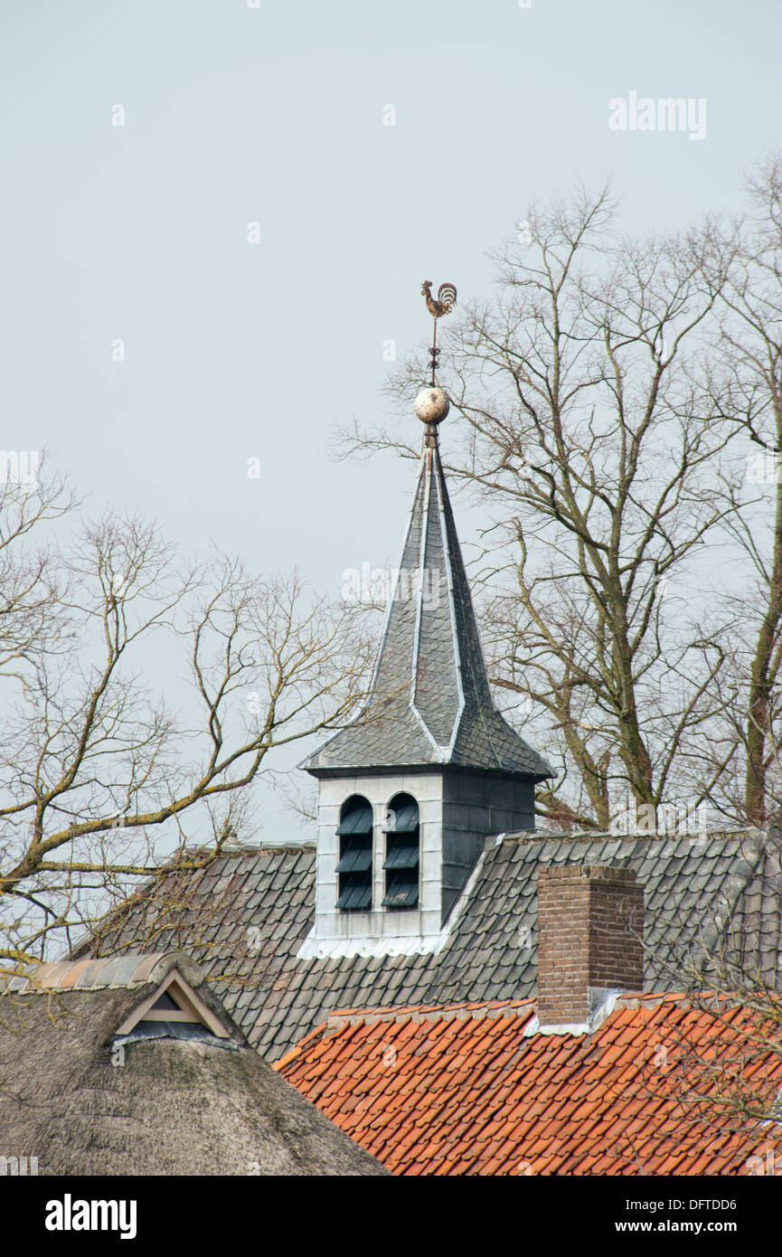 Roof tops and quadrangular belfry of the historic chapel at Bronkhorst ...