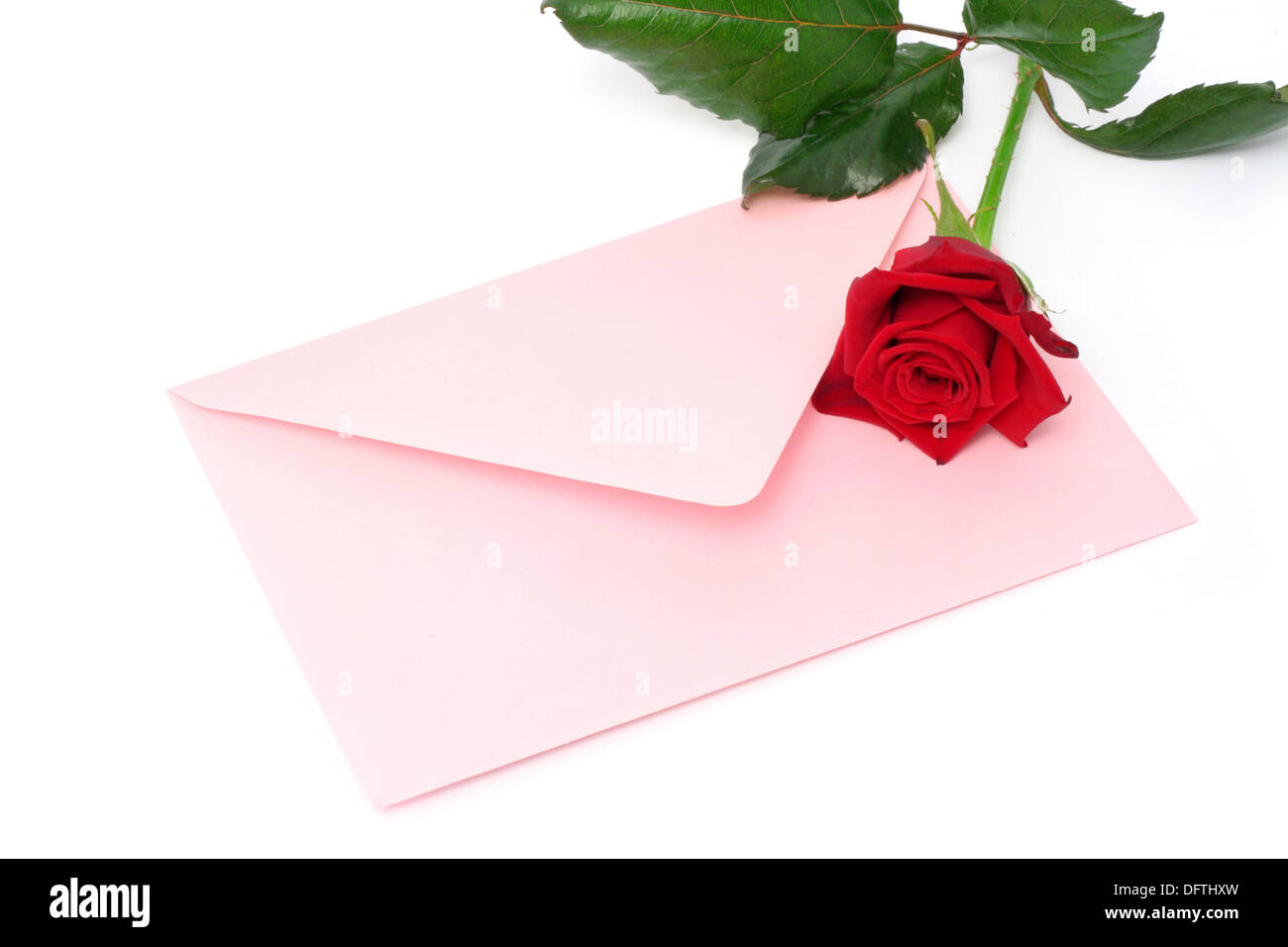 Pink love letter and red rose Stock Photo - Alamy