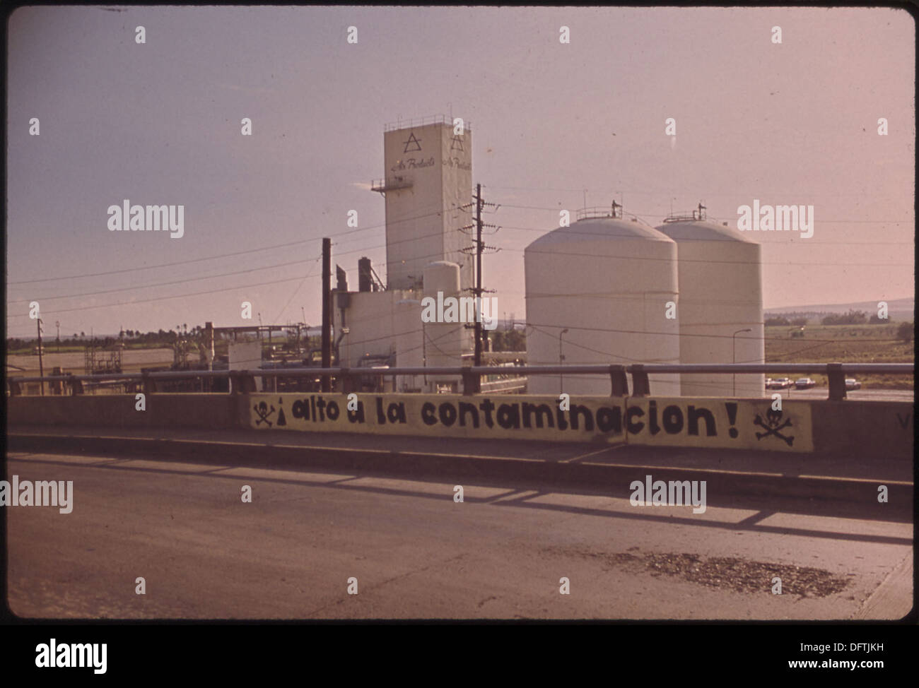 A sign on a bridge near the PPG plant protests the air pollution caused ...