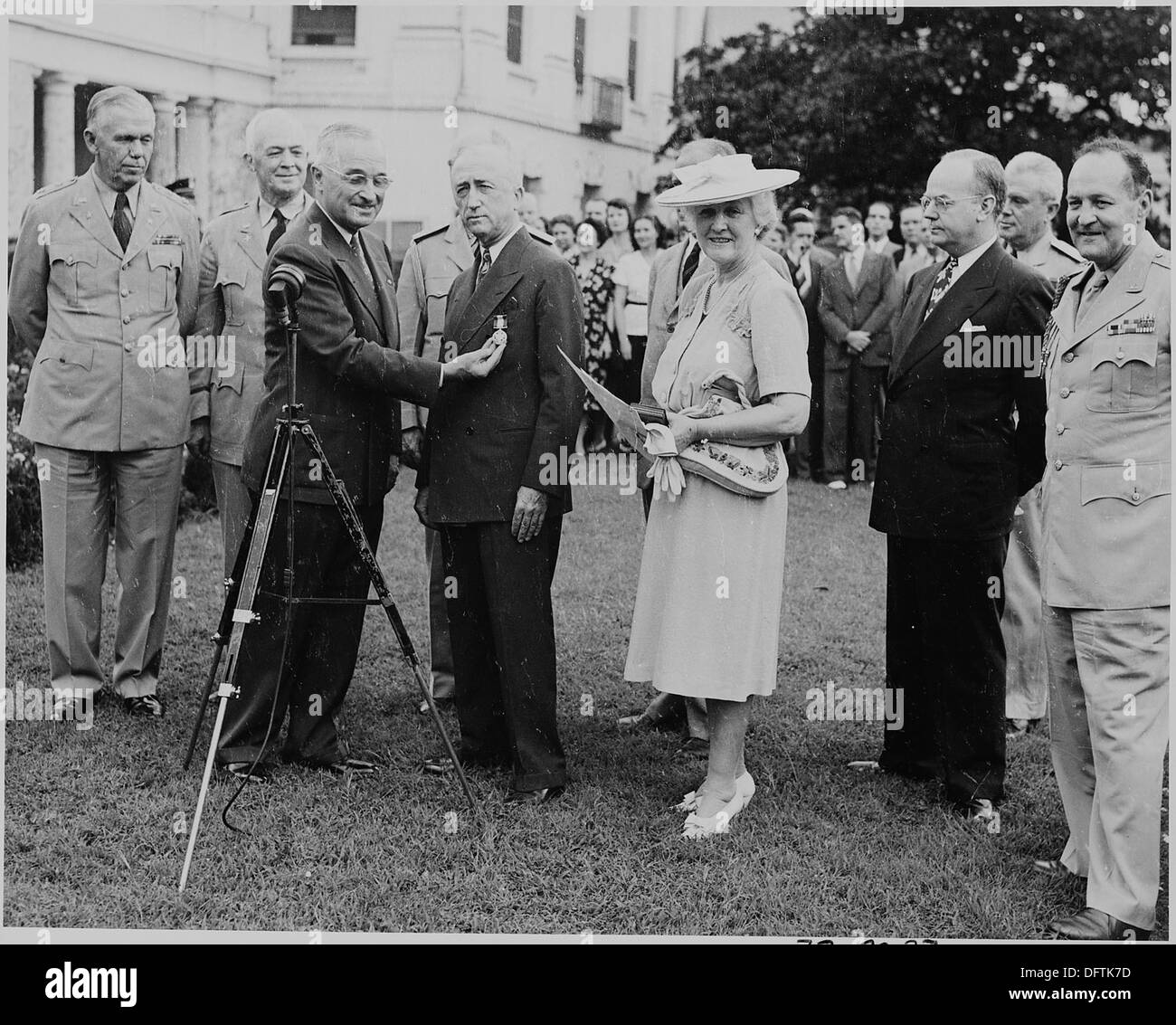 This photograph captures President Harry S. Truman awarding the ...