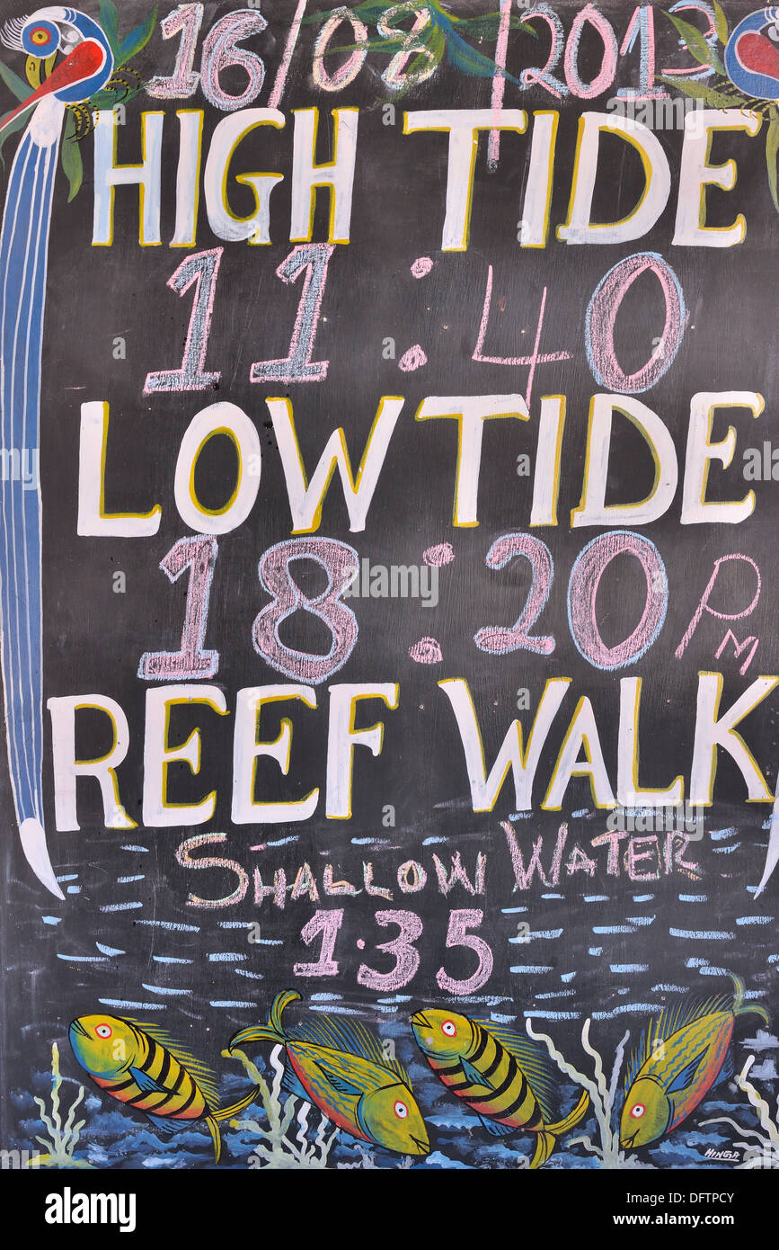 Sign with tidal information outside a diving school, Dongwe, Zanzibar ...