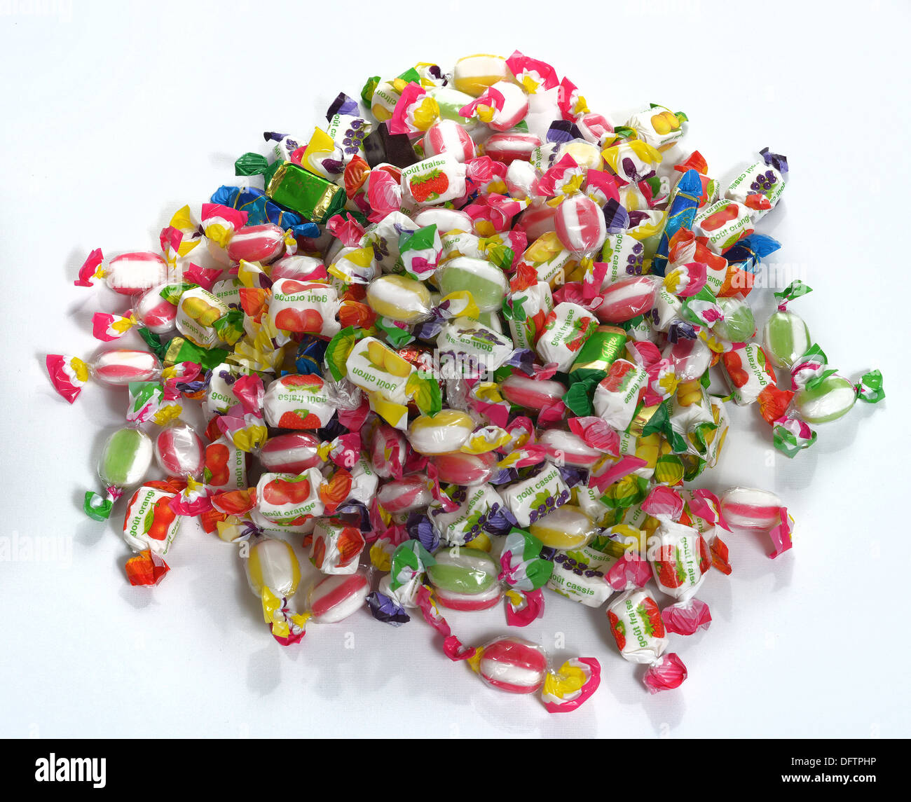 pile of candies on a white surface Stock Photo - Alamy