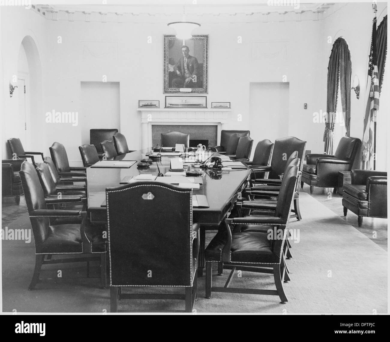 This photograph shows the Cabinet Room of the White House, featuring a ...