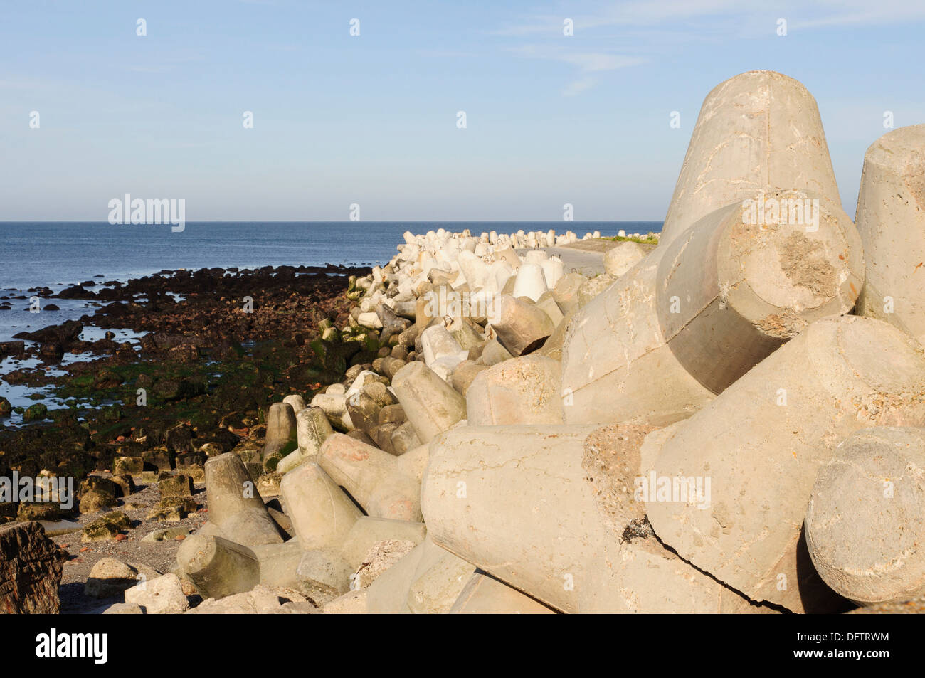 Coastal protection, stacked layers of tetrapods on the shore, Helgoland ...