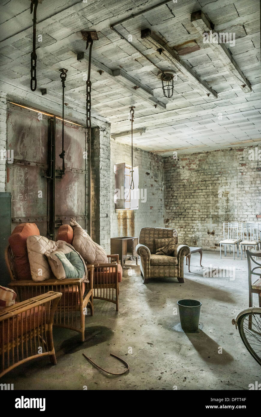 Abandoned squat in an old warehouse room Stock Photo - Alamy