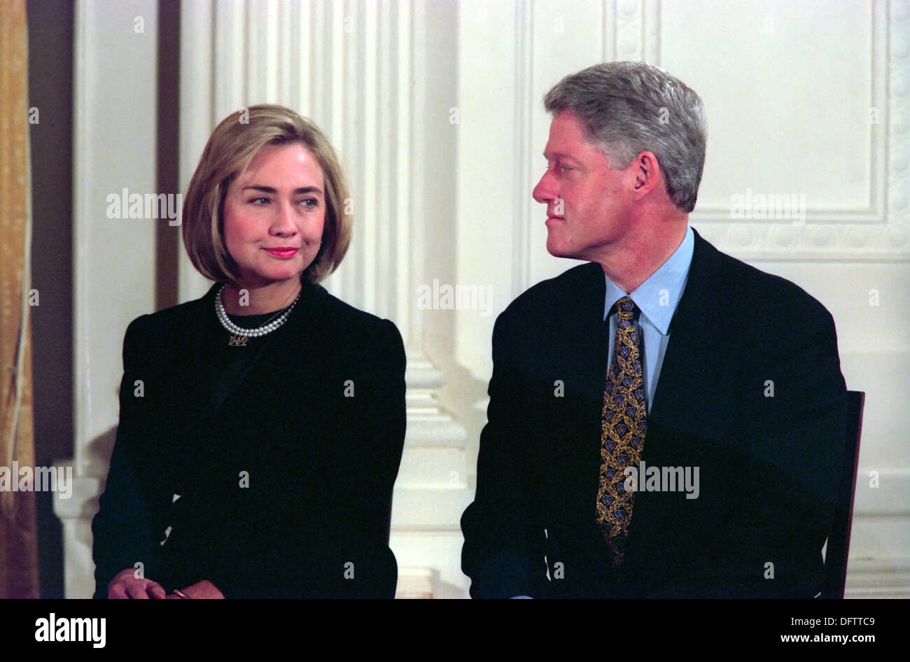 US President Bill Clinton sits with First Lady Hillary Clinton during ...