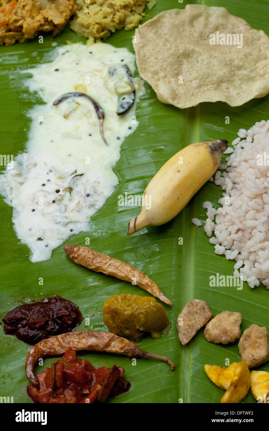 onam festival food served on banana leaf Stock Photo - Alamy