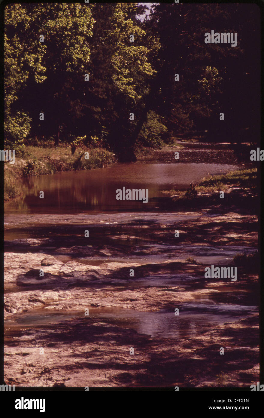 A photograph showing a roadside drainage canal, illustrating an ...