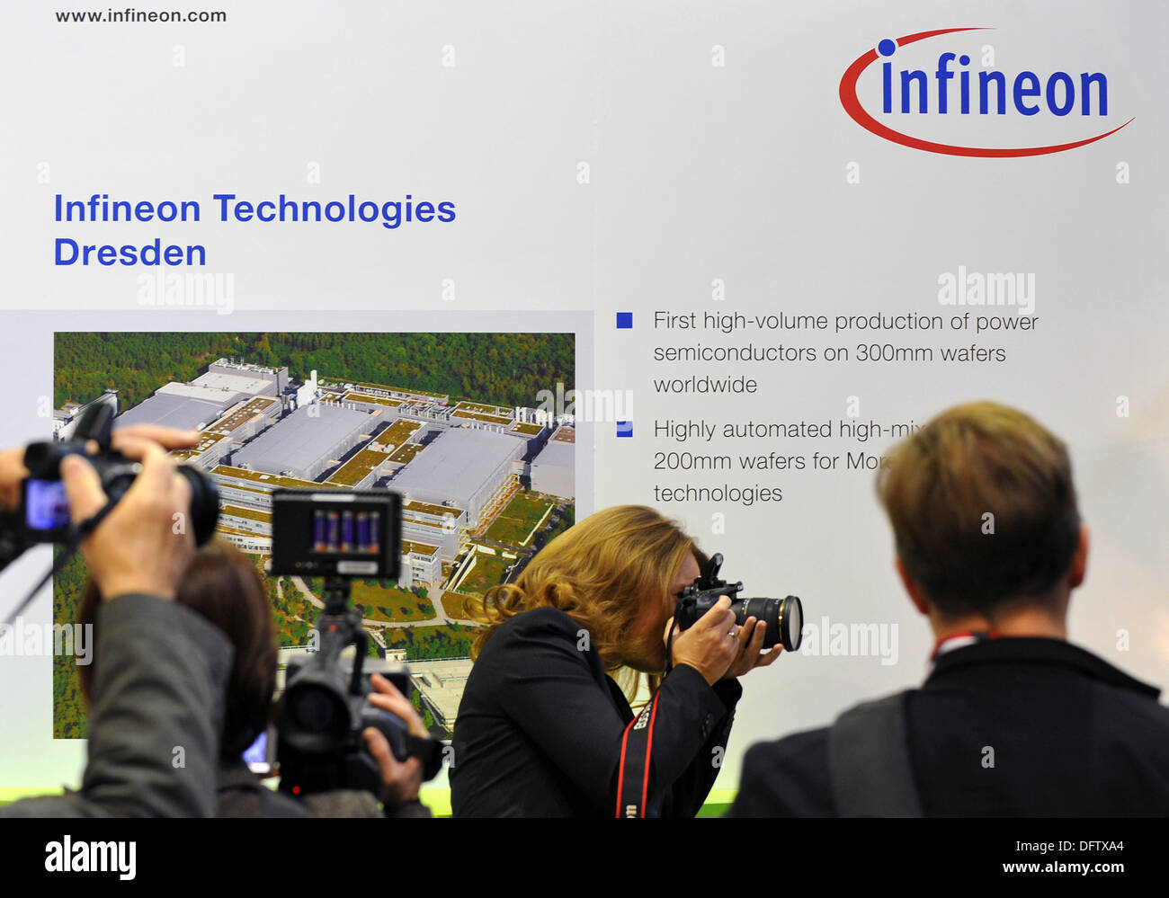 Dresden, Germany. 09th Oct, 2013. Photographers stand next to the stand ...