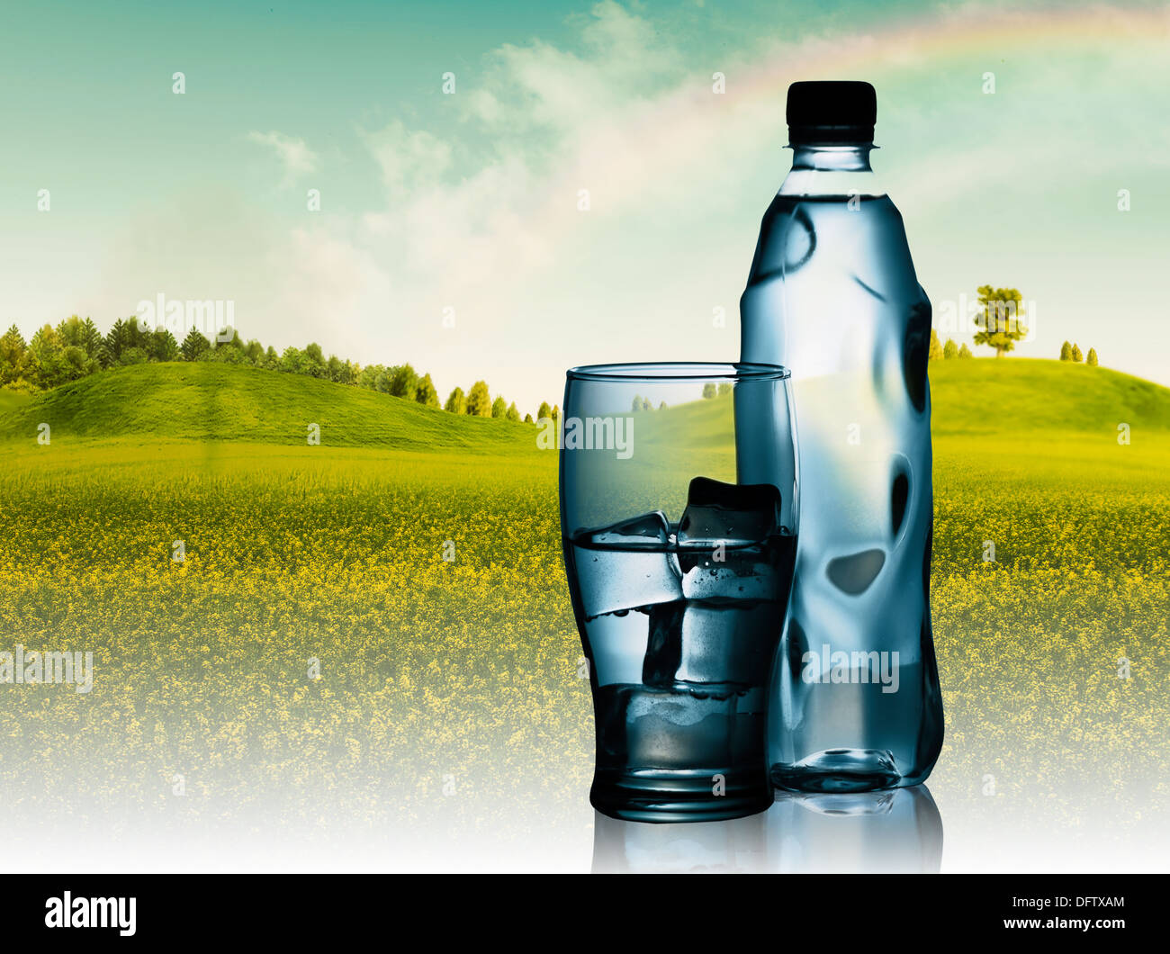 Spring mineral water bottled with glass and ice against natural ...