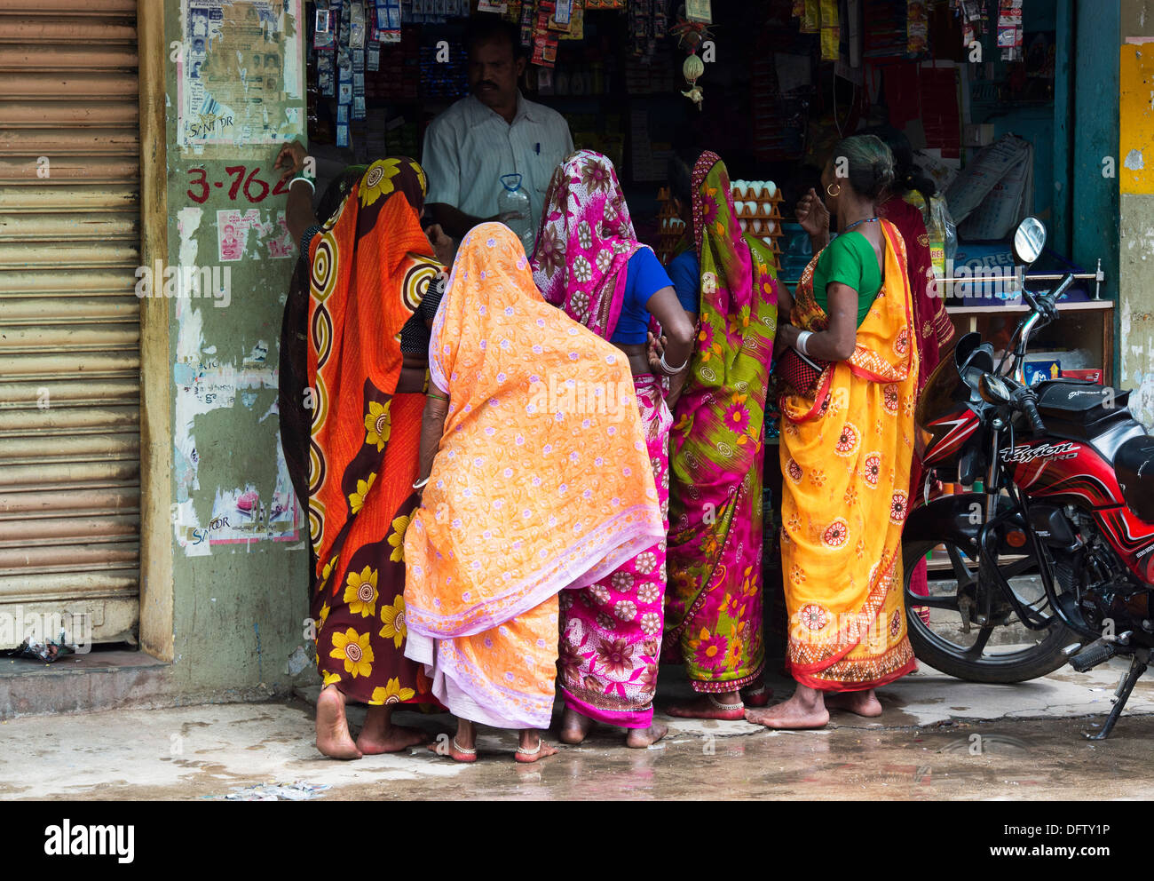 Group of indian women outside a town shop. Puttaparthi, Andhra Pradesh ...