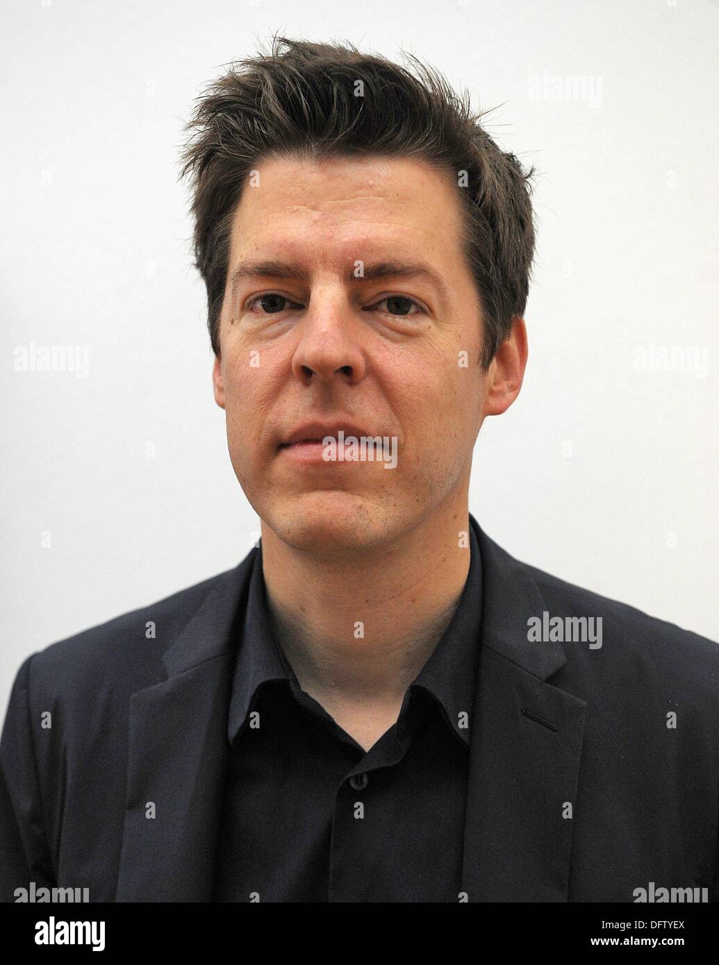 Cologne, Germany. 09th Oct, 2013. Director Philipp Kaiser stands during ...