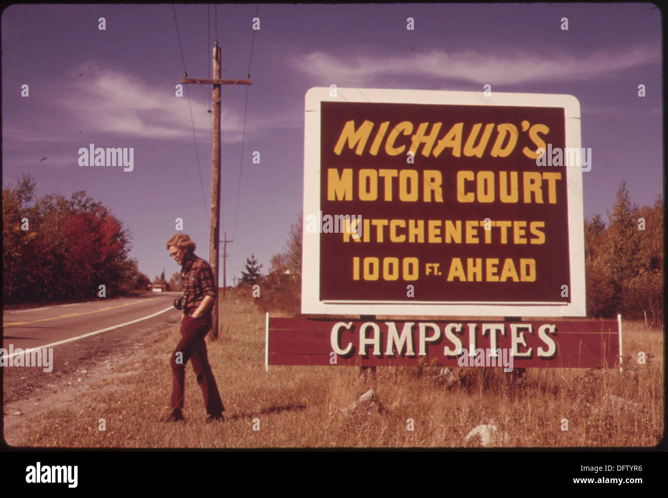 An unattractive sign located at the edge of Route 73. Due to its ...