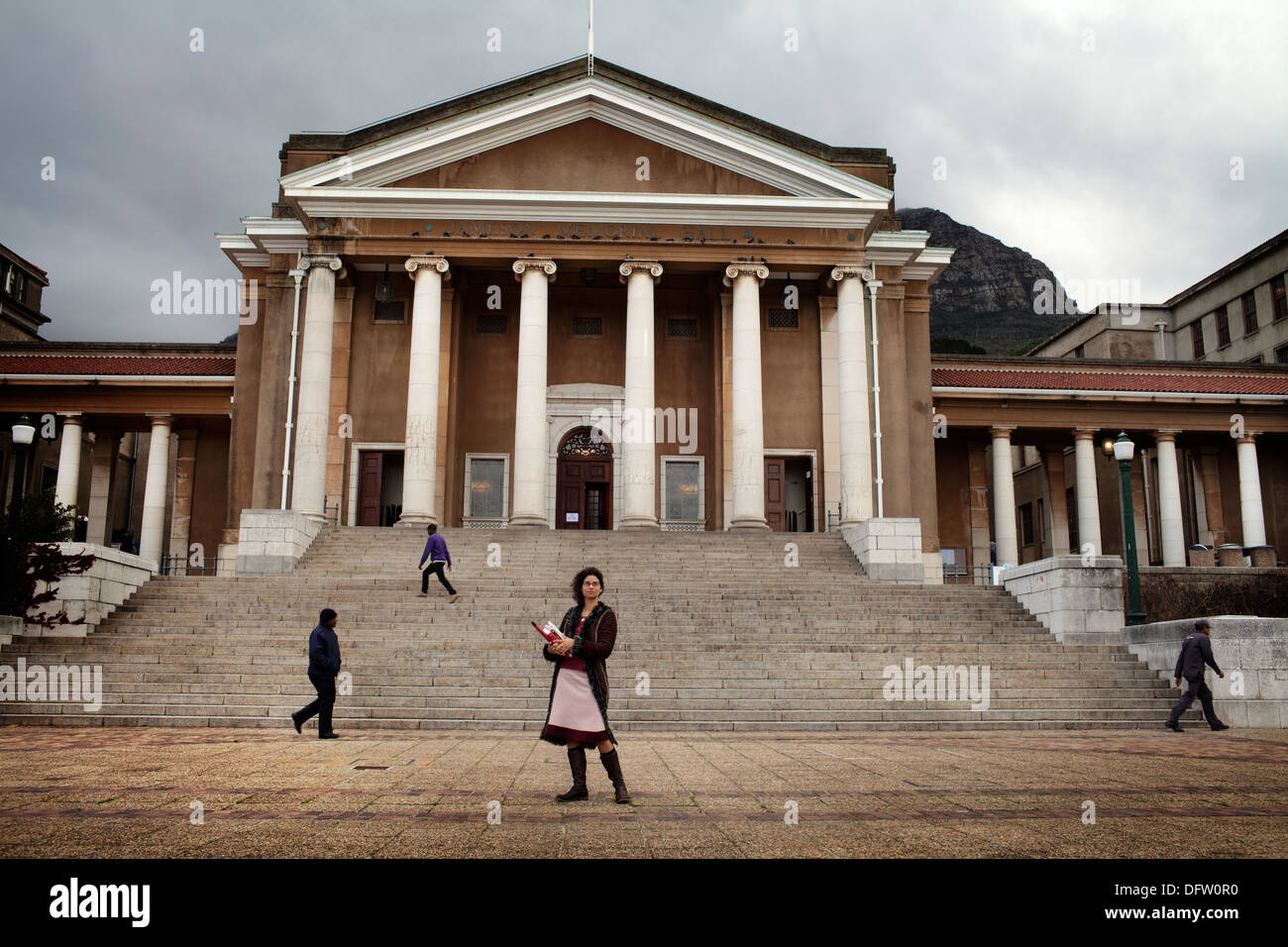 Nicole, postgraduate student, holds books in her arms as she stands in ...