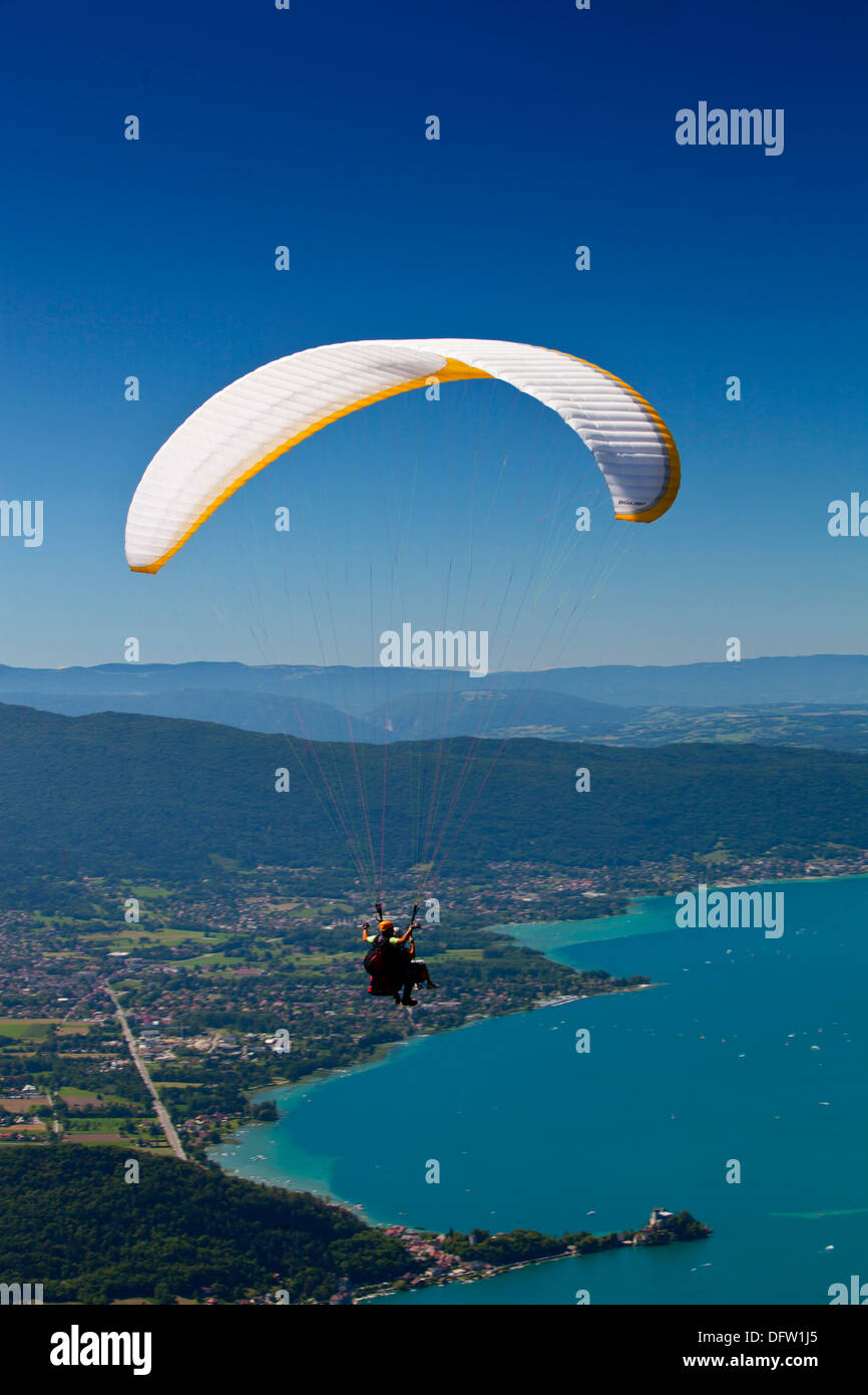 Hang glider pilot & passenger flying towards Lake Annecy Stock Photo ...