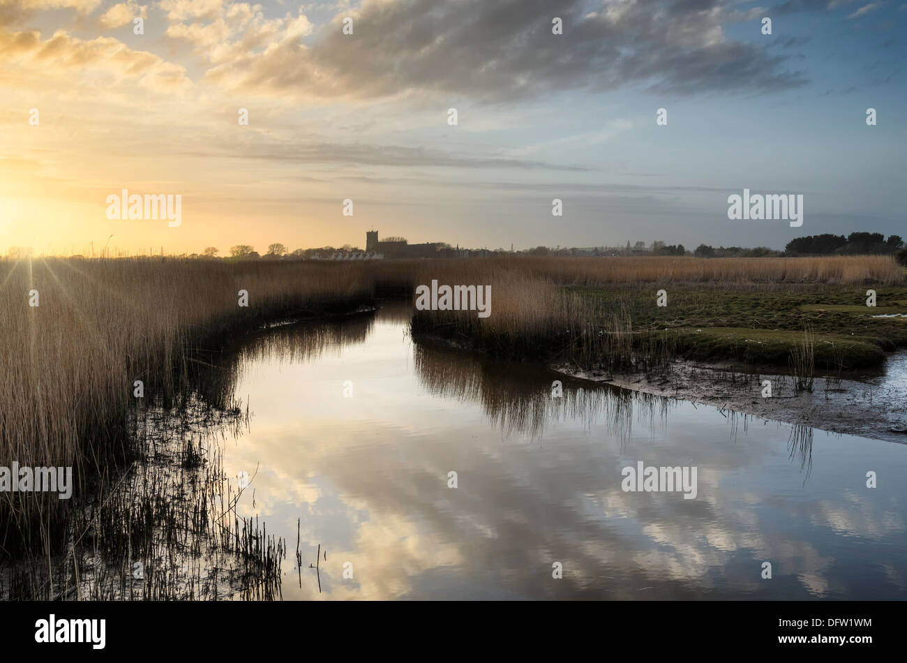 Looking out across Stanpit Marsh towards the priory at Christchurch in ...