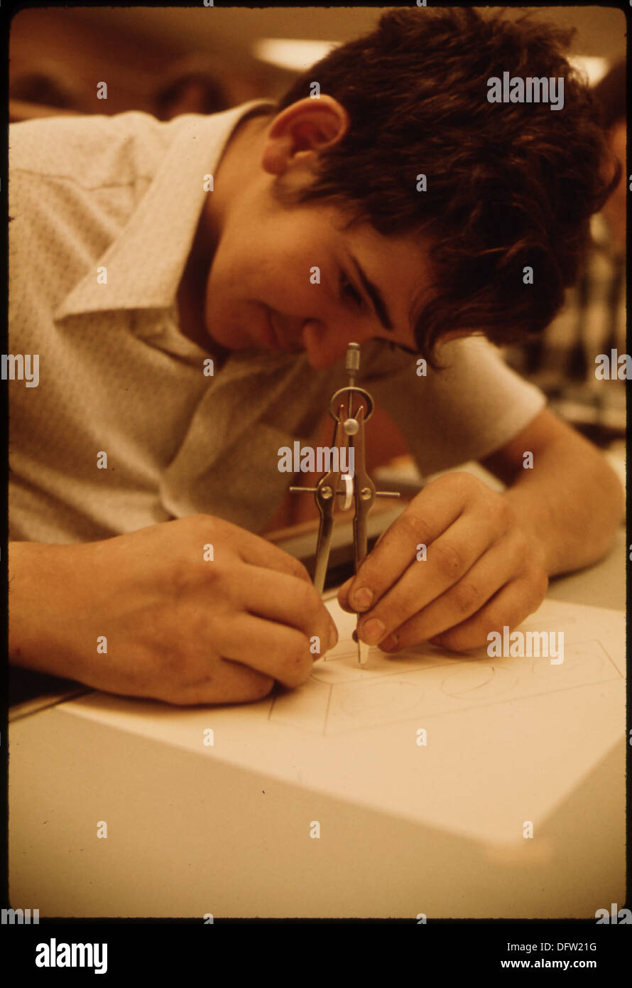 STUDENTS WORKING INTENTLY IN A DRAFTING CLASS AT SENIOR HIGH SCHOOL IN ...