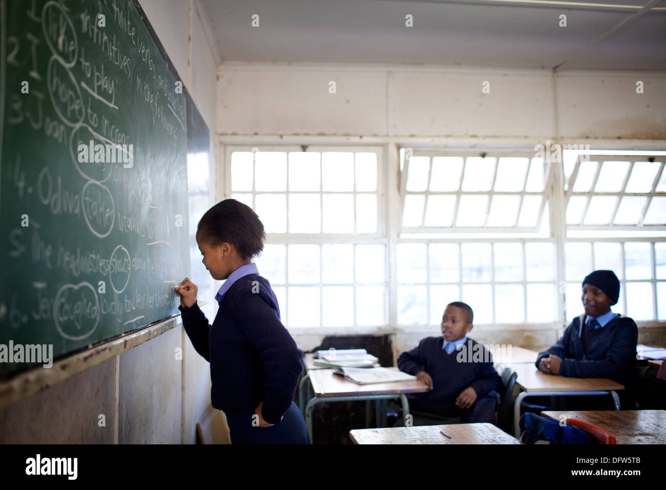 African schoolgirl writes on hi-res stock photography and images - Alamy