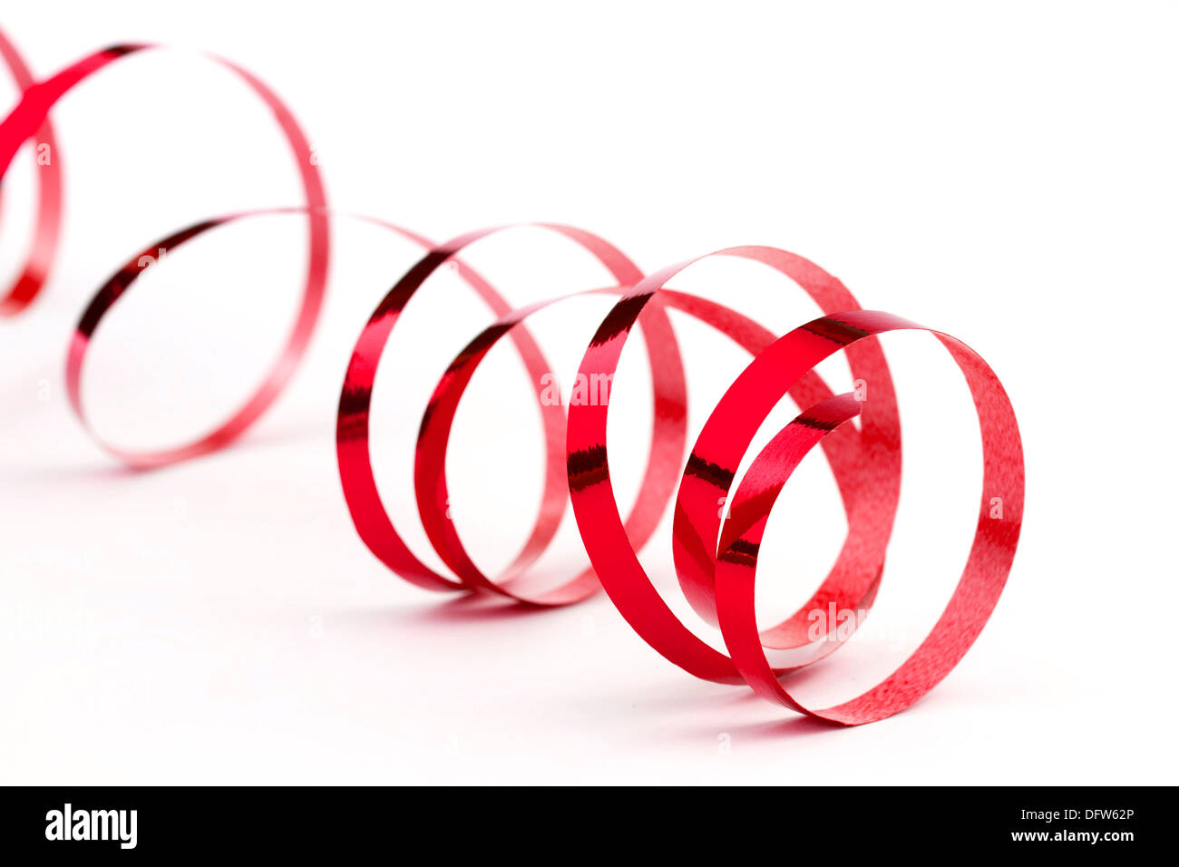 Red christmas foil ribbon on white Stock Photo - Alamy