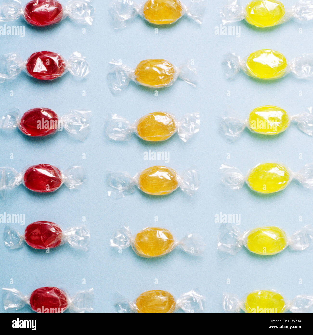 Three columns of colour candy. Red, orange and yellow Stock Photo - Alamy