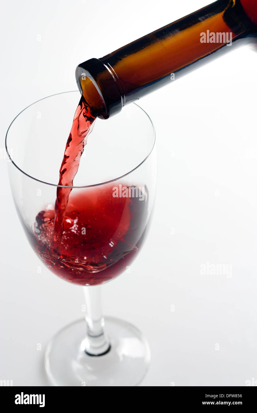 Wine flowing into a glass Stock Photo - Alamy