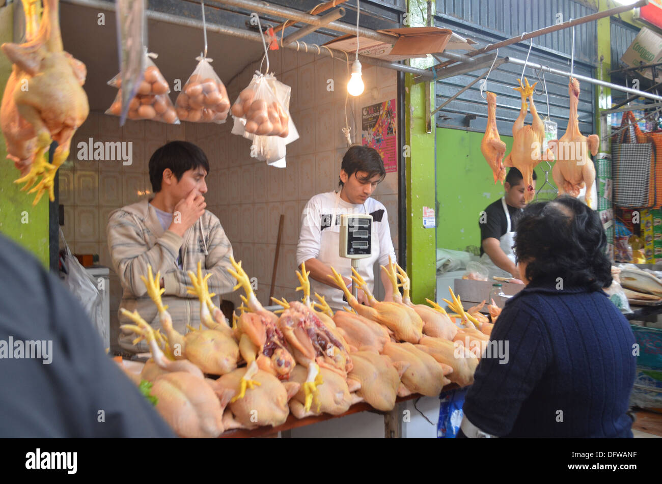 Locals shopping at a butchers market in Lima, Peru Stock Photo - Alamy