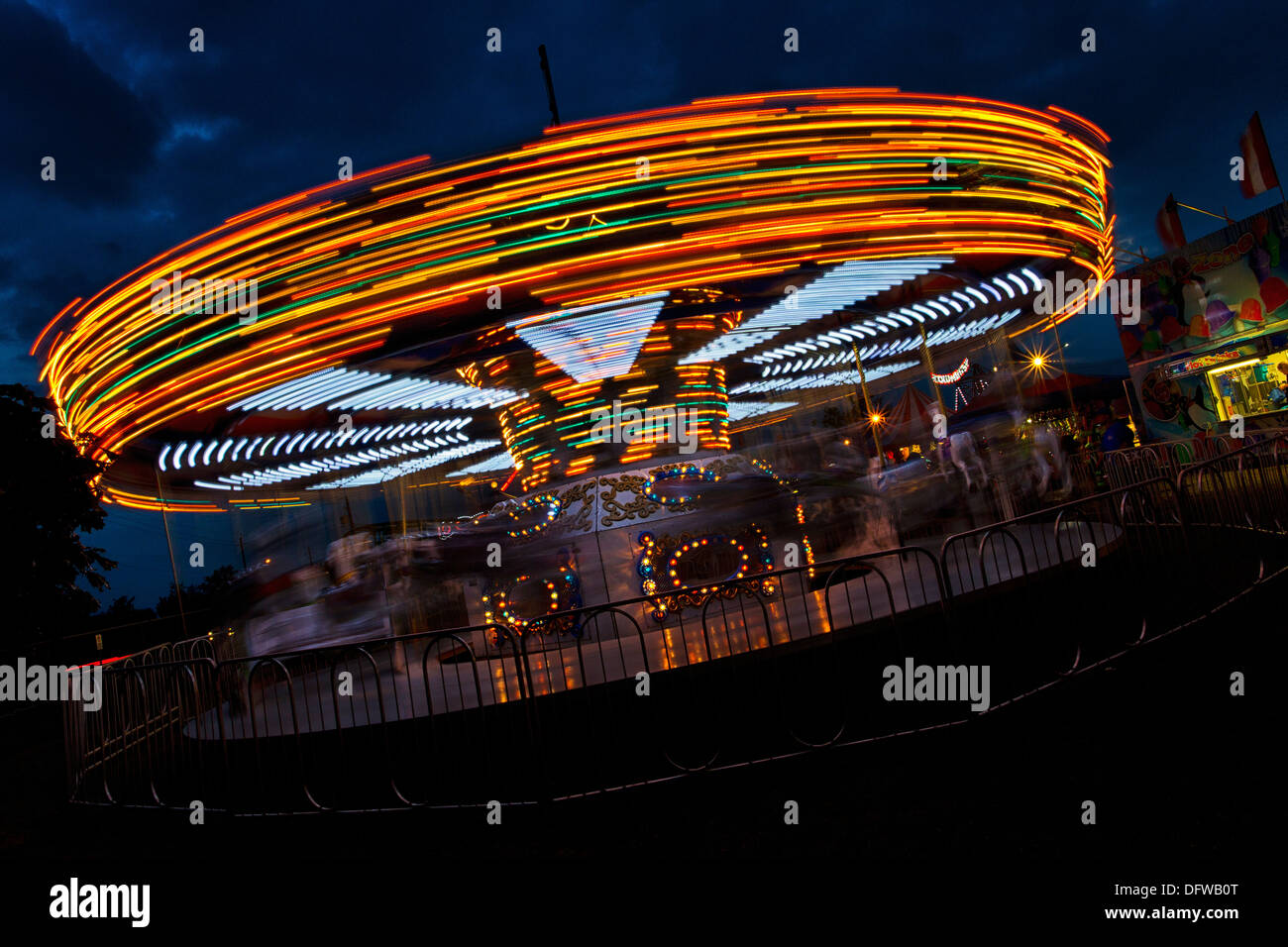 Fairground rides at night Stock Photo - Alamy
