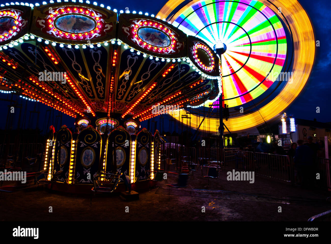 Fairground rides at night Stock Photo - Alamy