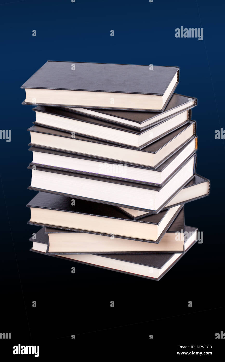 Stack of hardcover books on a colorful background Stock Photo - Alamy