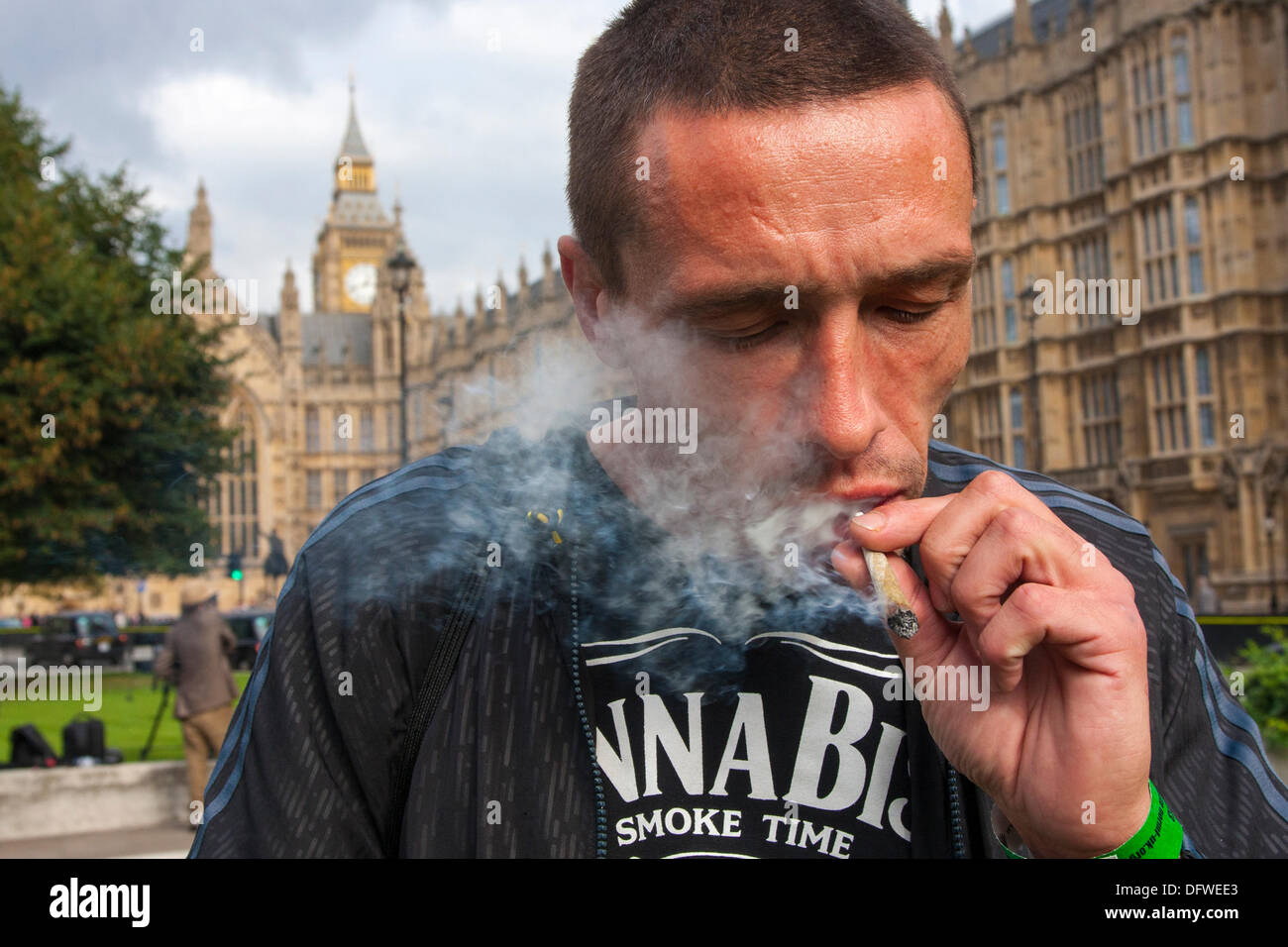 London, UK. 09th Oct, 2013. A campaigner enjoys a smoke as NORML UK ...