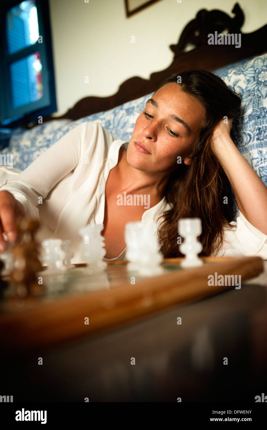 Beautiful girl playing chess hi-res stock photography and images - Alamy