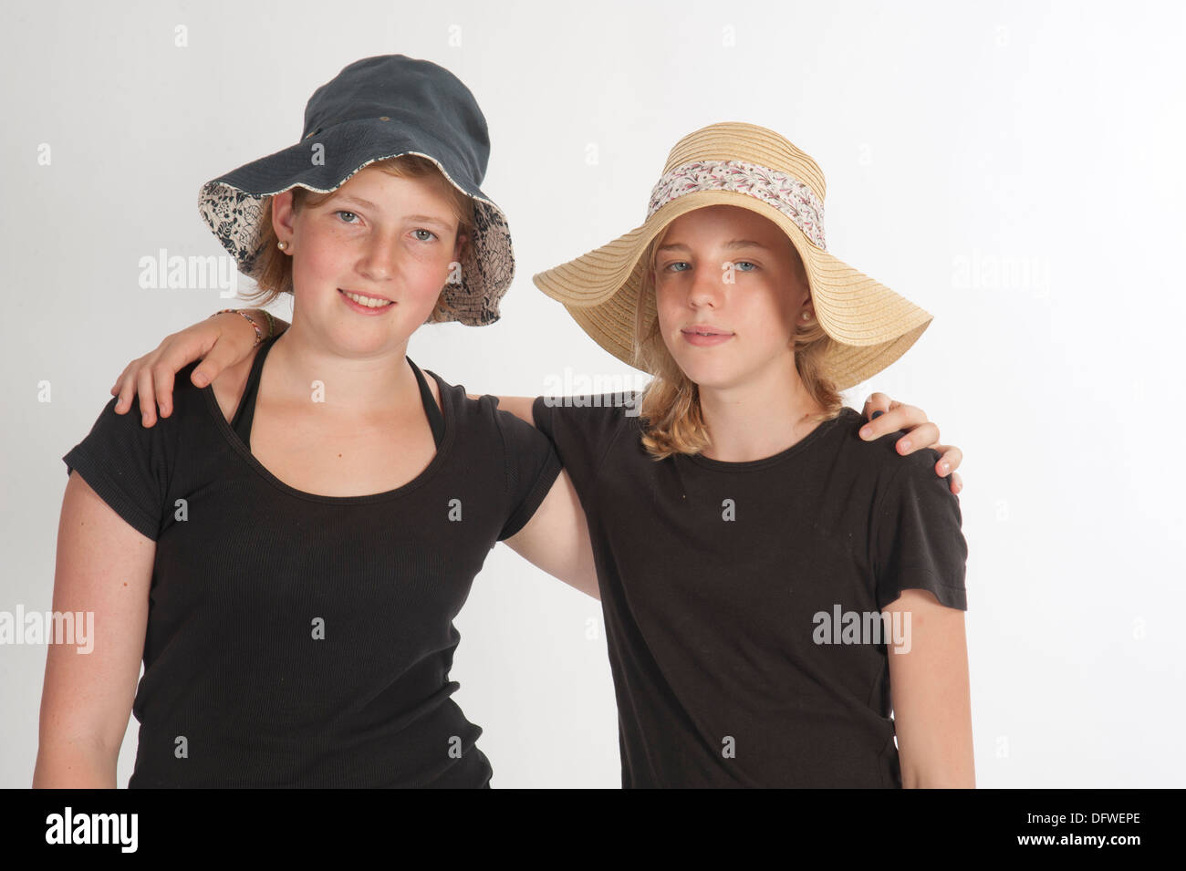 Two teenage girls with hats Stock Photo - Alamy
