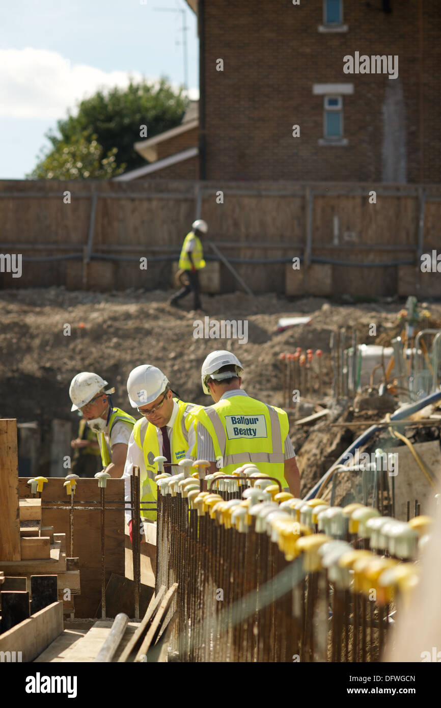 men working on a building site Stock Photo - Alamy