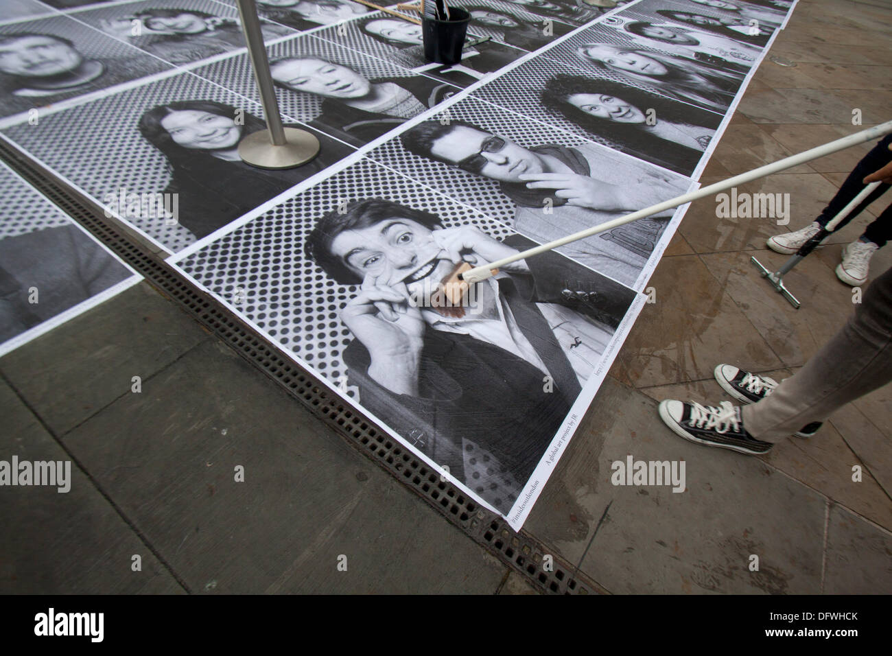 London UK. 9th October 2013. Giant portraits are stuck on the terrace ...