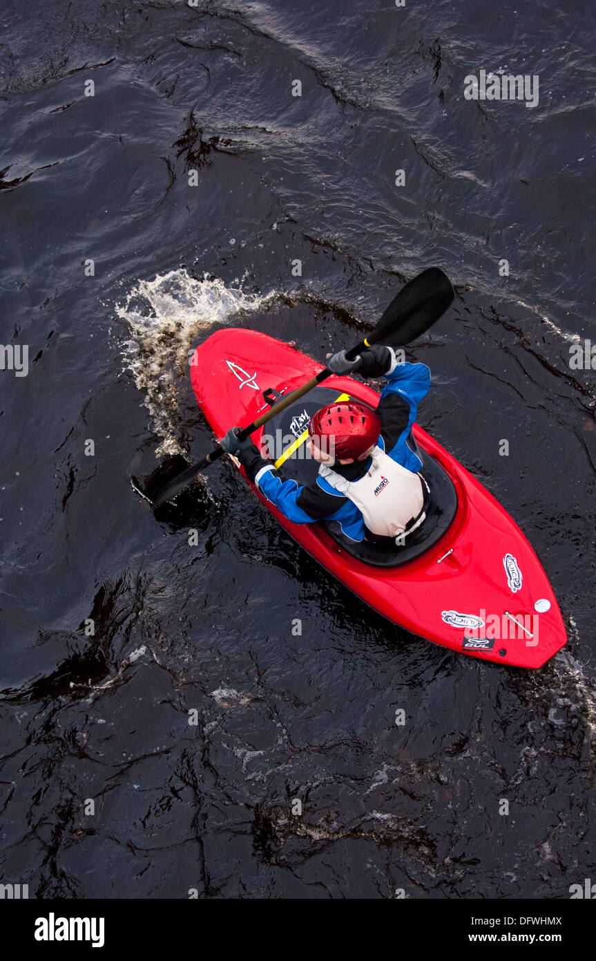 View of single red kayak with kayaker from above Stock Photo - Alamy