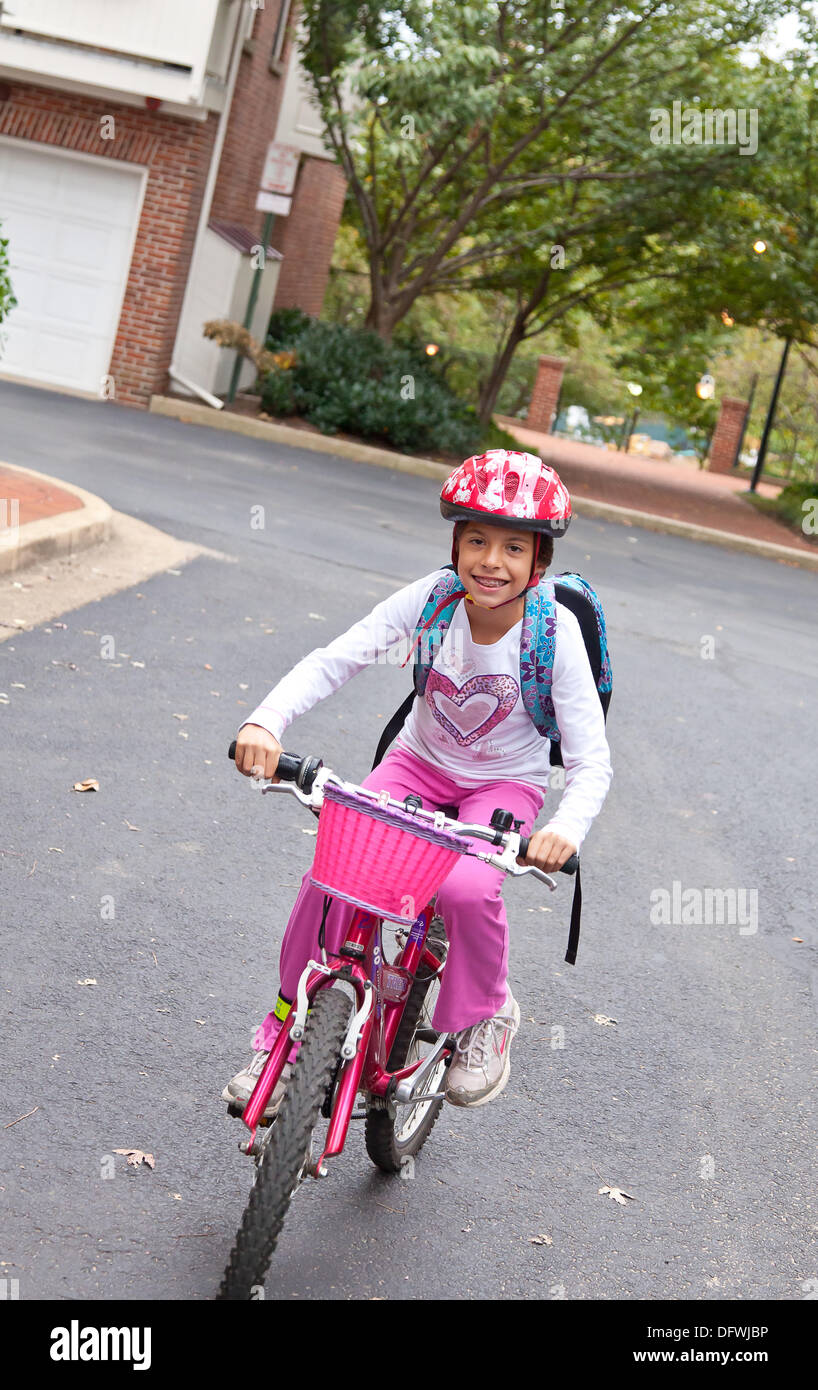 Arlington, Virginia, USA. 9th Oct, 2013. Elementary school student Sofia Rosato (8) bikes to ...