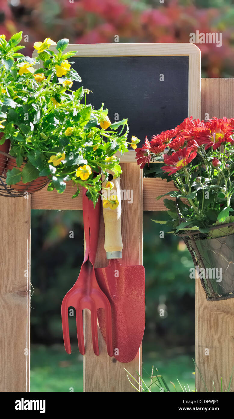 slate with flower pots and gardening tools fall Stock Photo - Alamy