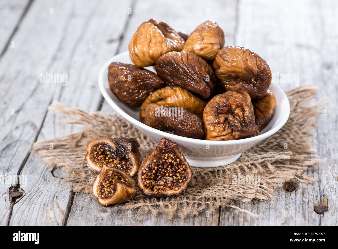 Figs (dried) on a wooden background Stock Photo - Alamy