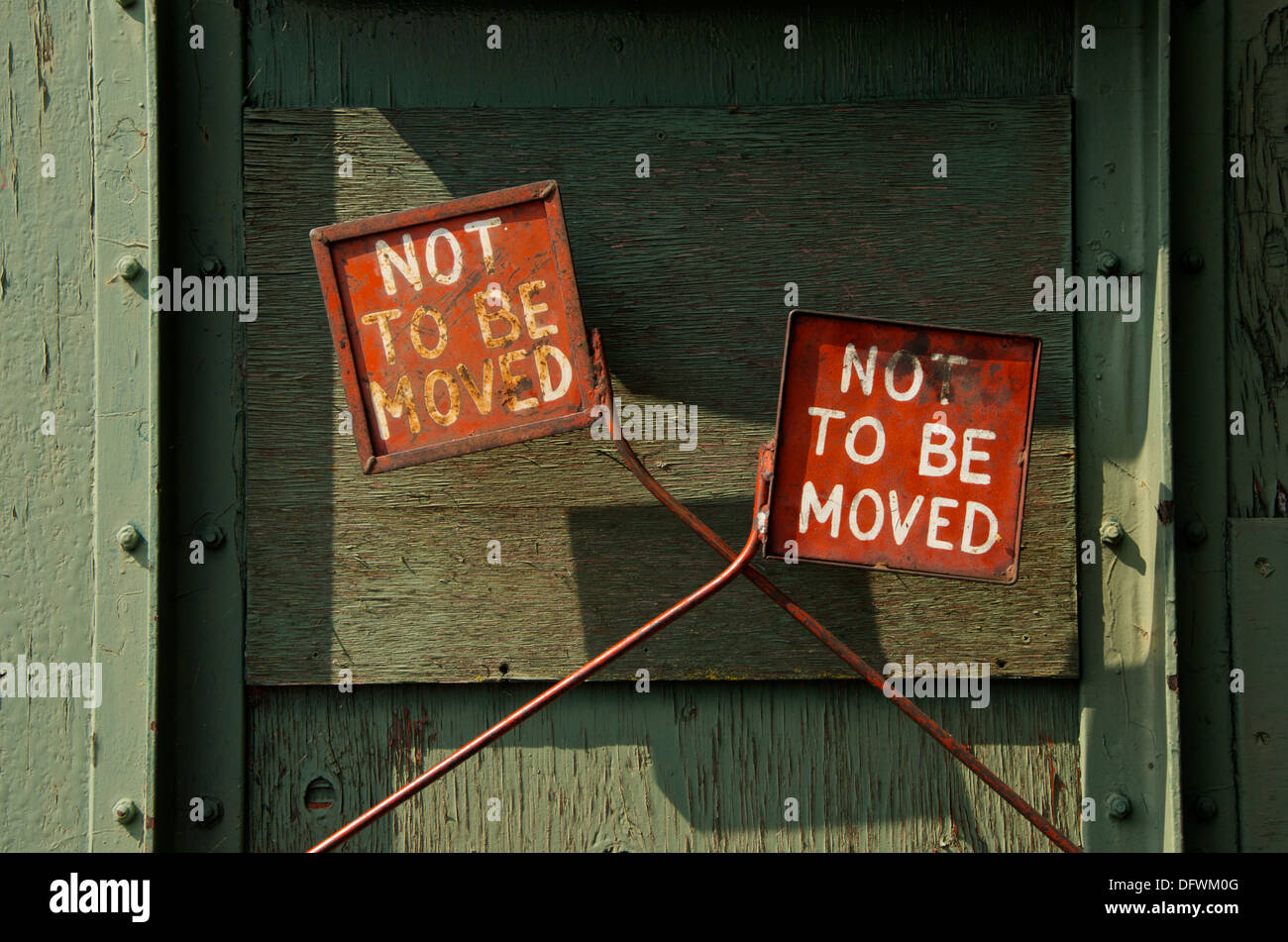 NOT TO BE MOVED signs on an old derelict railway waggon Stock Photo - Alamy